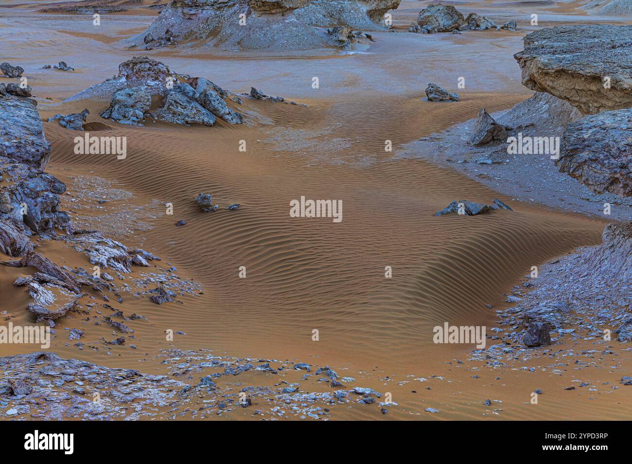 Striking cliffs surrounded by windswept sand structures, Huqf stone desert, Arabian Peninsula ...
