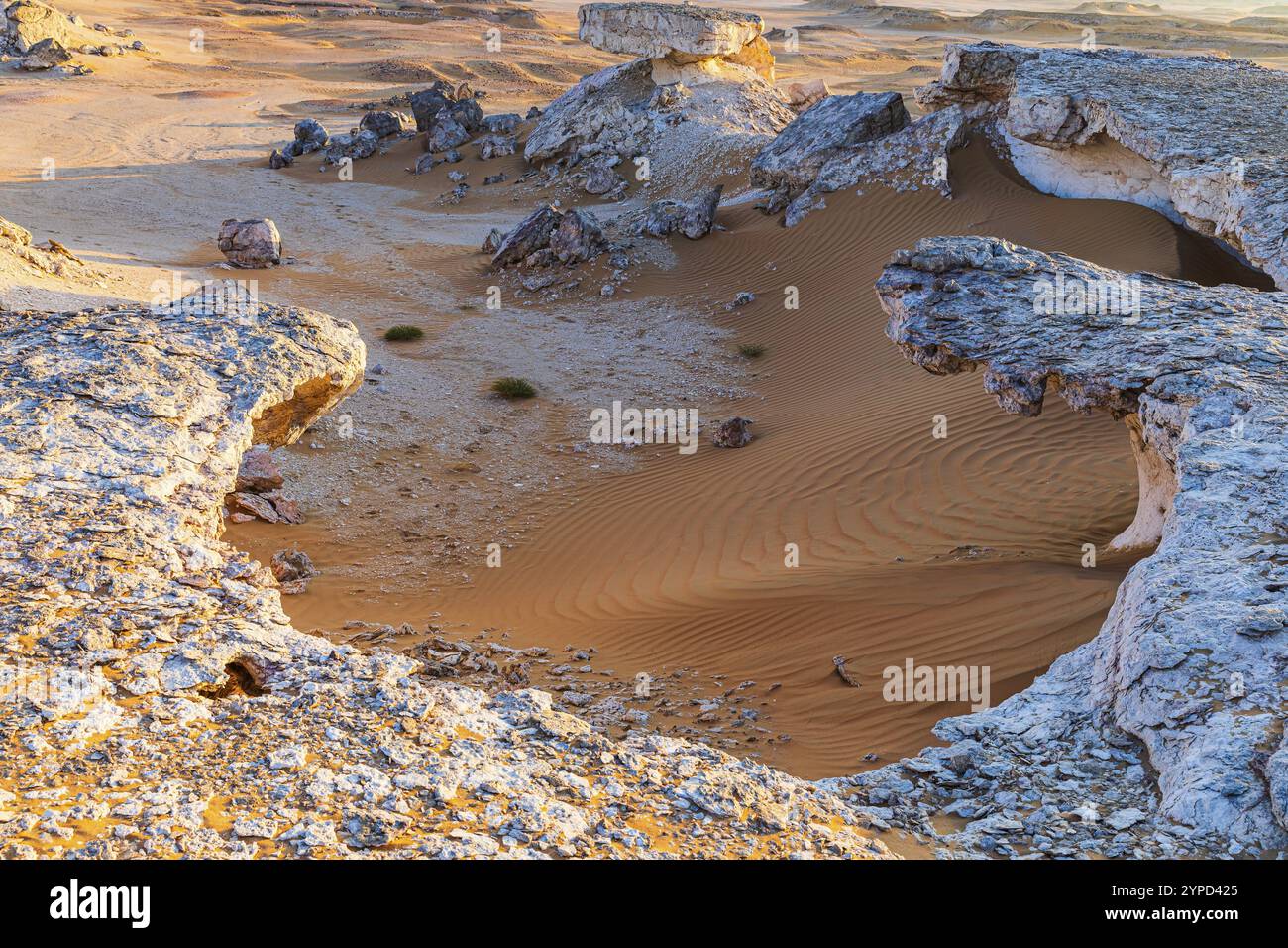 Striking cliffs surrounded by windswept sand structures, Huqf stone ...