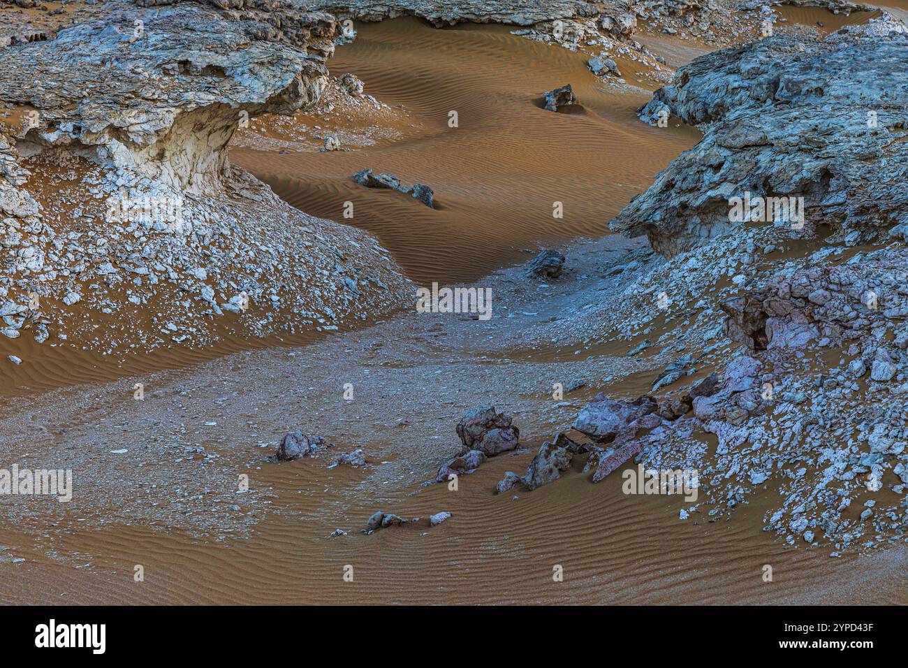 Striking cliffs surrounded by windswept sand structures, Huqf stone desert, Arabian Peninsula ...
