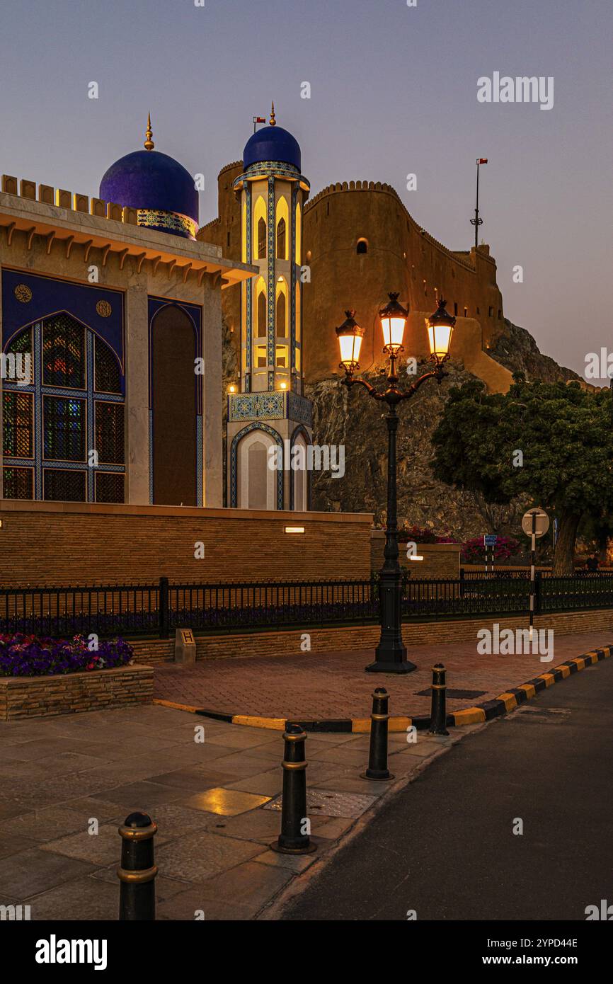 The illuminated Al Khor Mosque with three-light candelabra, behind the ...