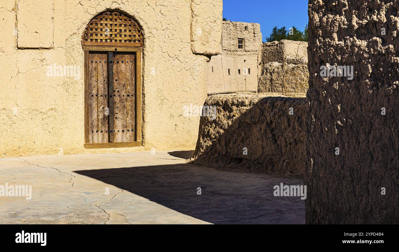 Decorated round arch entrance door in the largest preserved mud town in ...