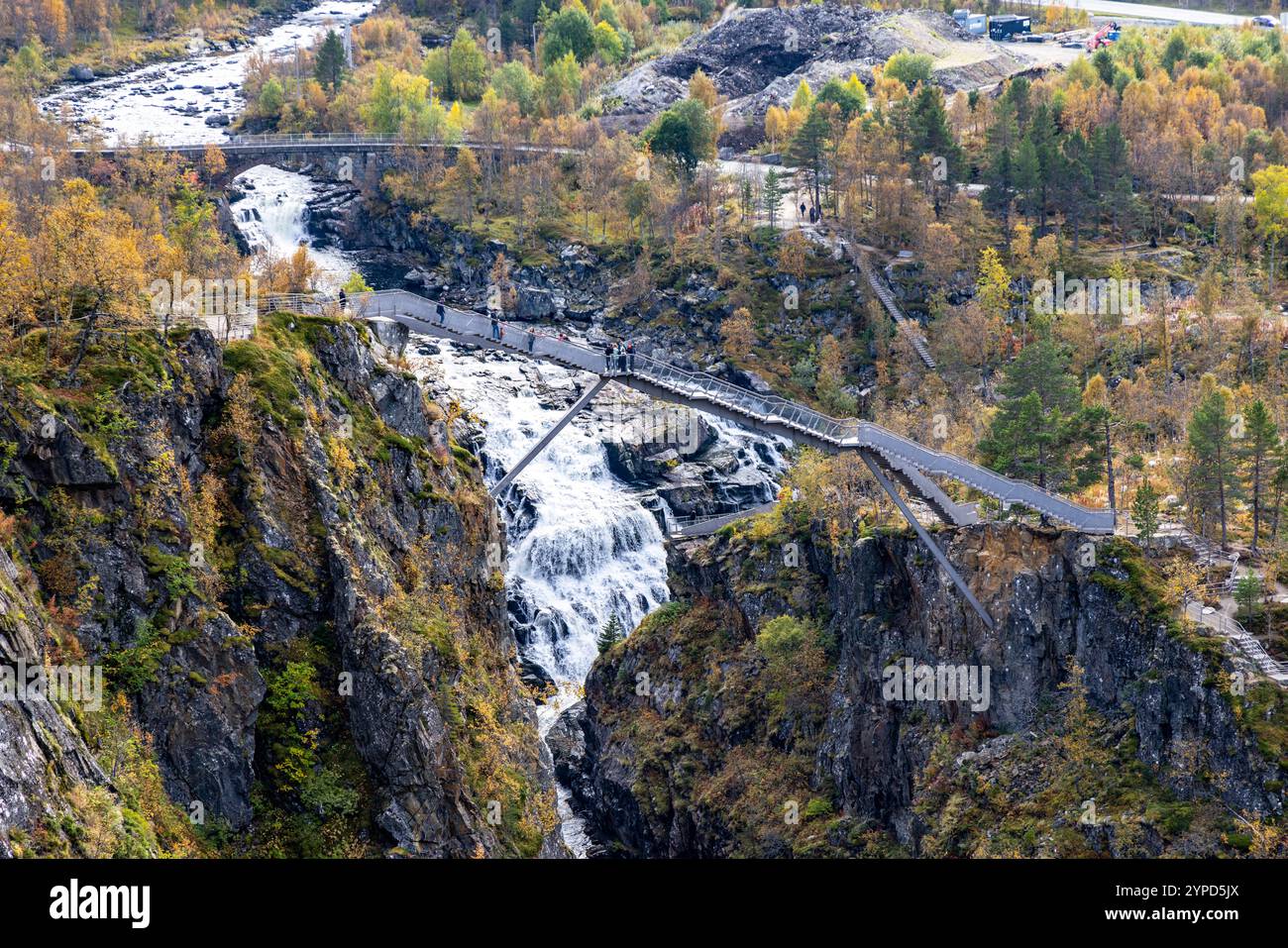 Voringfossen waterfall, Eidfjord,Norway, visitors walk across the ...