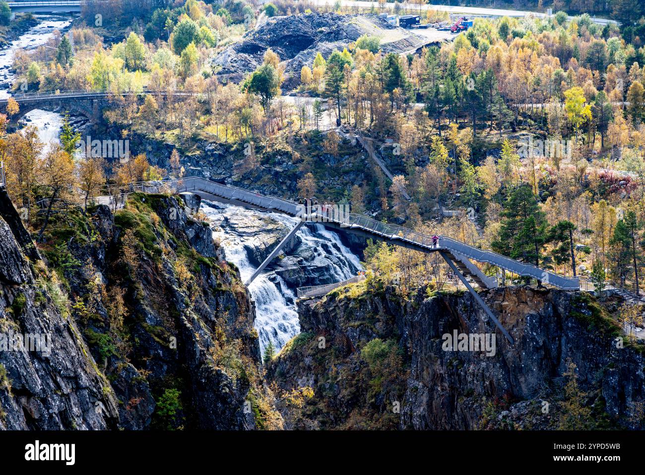 Voringfossen waterfall, Eidfjord,Norway, visitors walk across the ...