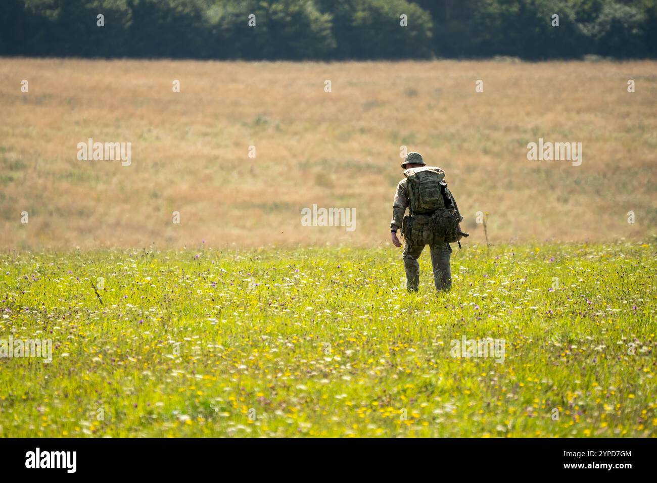 army soldier with gun on a 40kg loaded march tab military exercise ...