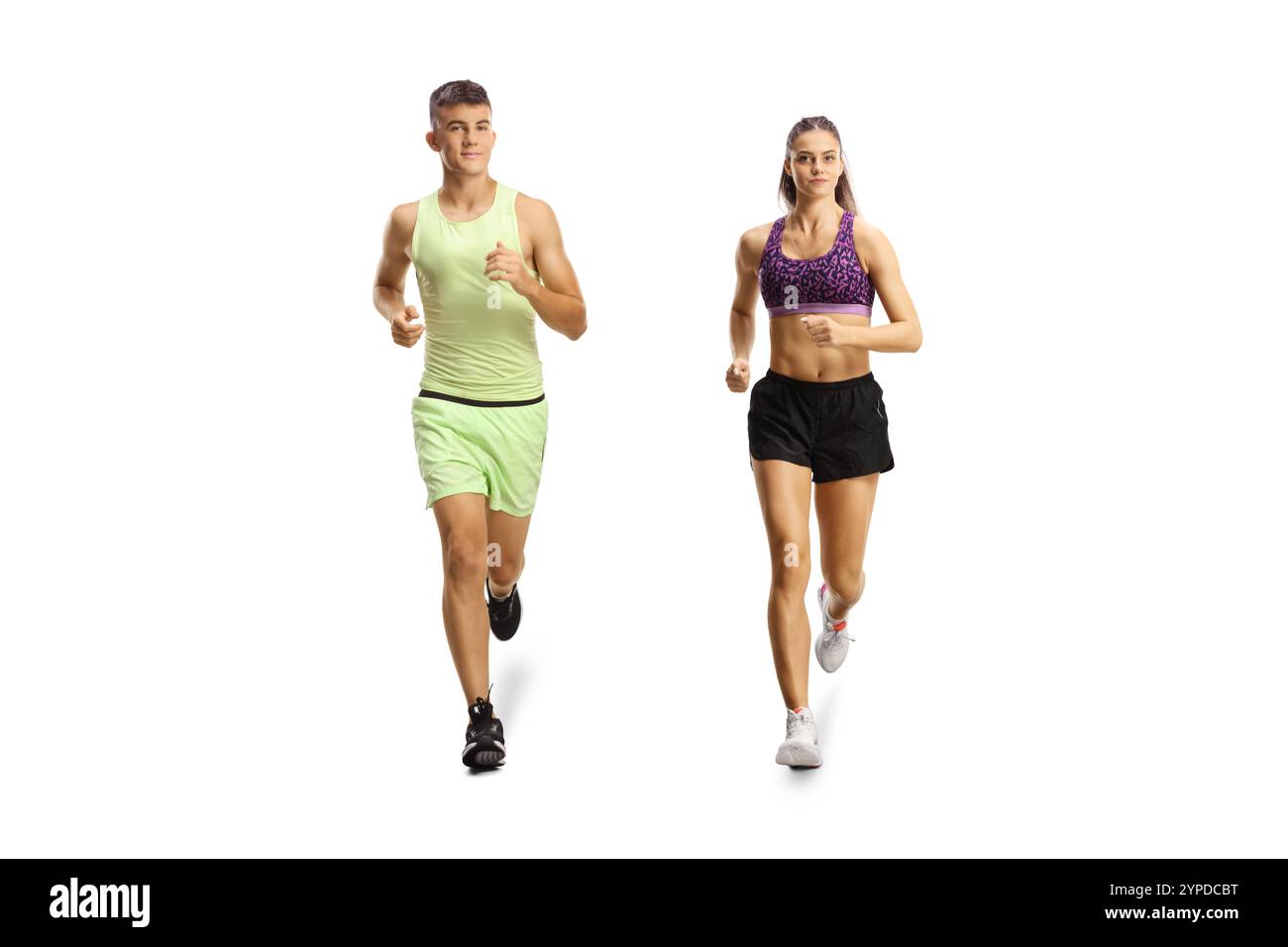 Young man and woman in sportswear jogging towards camera isolated on ...