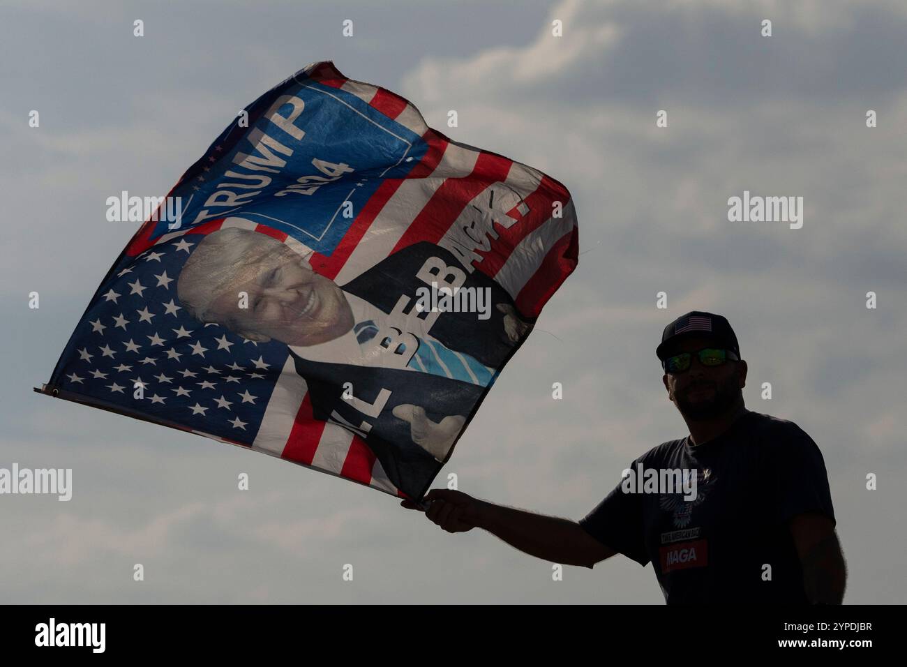 Jestin Nevarez, of Palm Beach County, Fla., waves a flag with the ...