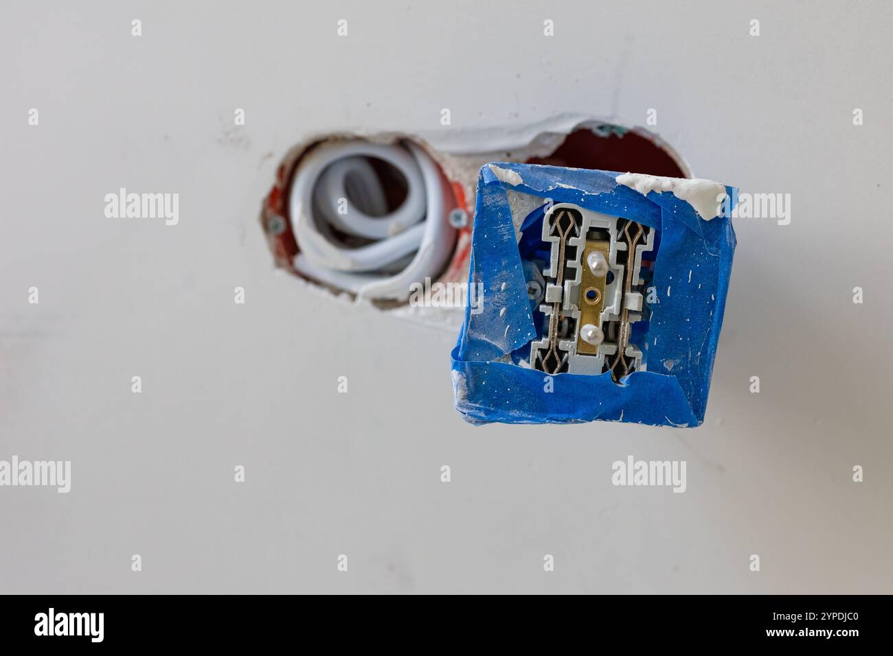 Close-up view of an electrical outlet installation in progress with ...