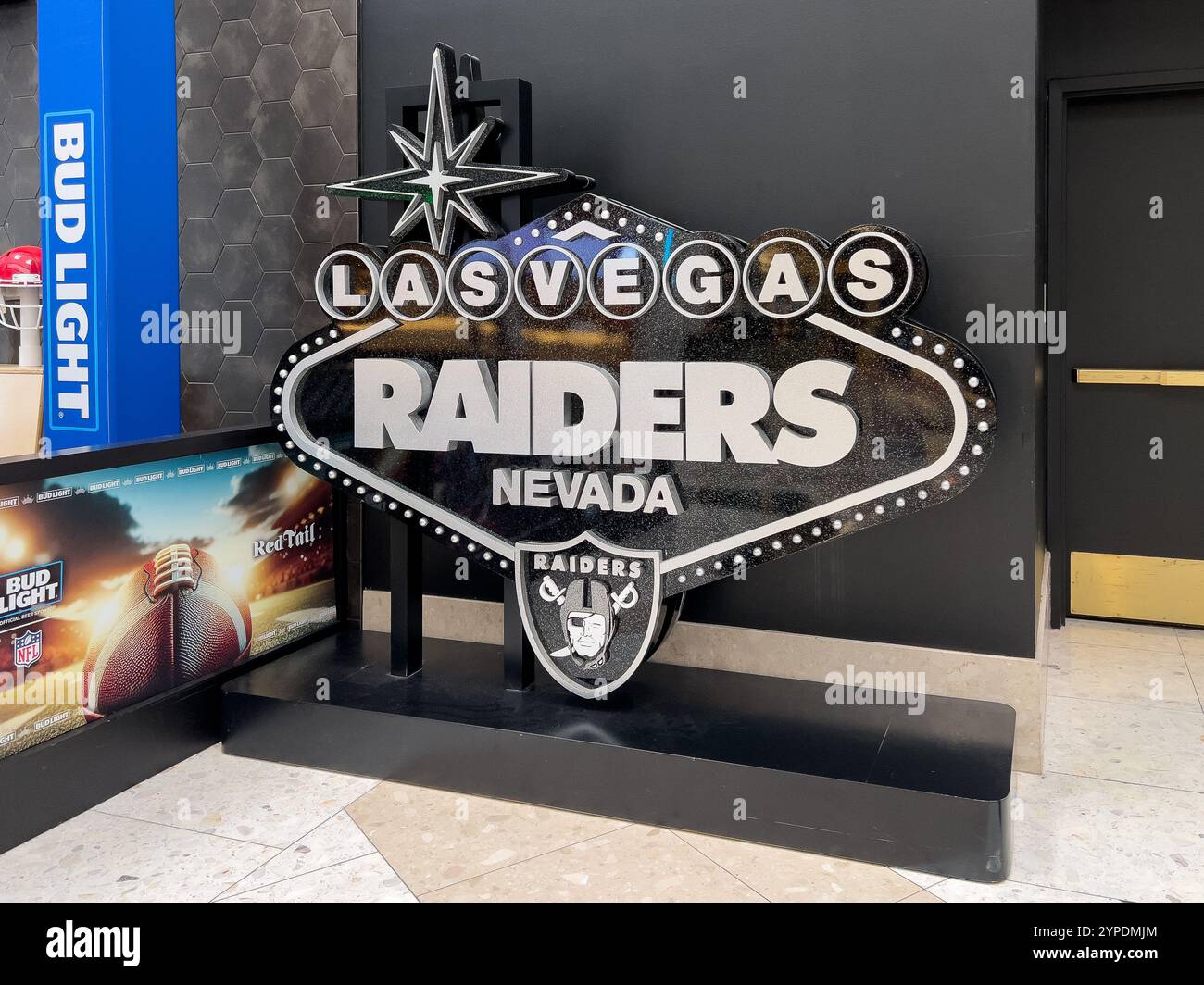 An NFL Las Vegas Raiders sign shaped like the Welcome to Vegas sign ...