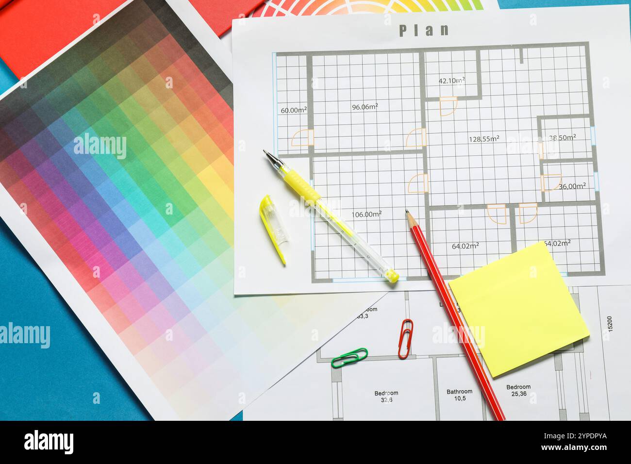 Designer's workplace with house plans, color palettes and stationery on ...
