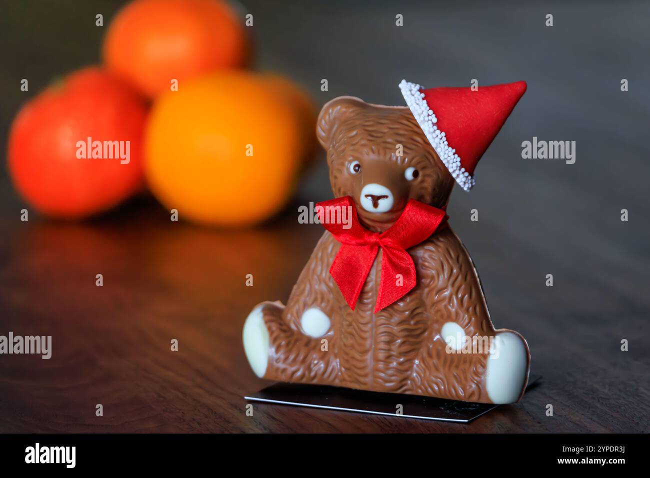 Fresh, gourmet chocolate bear wearing a Santa hat, a seasonal specialty ...