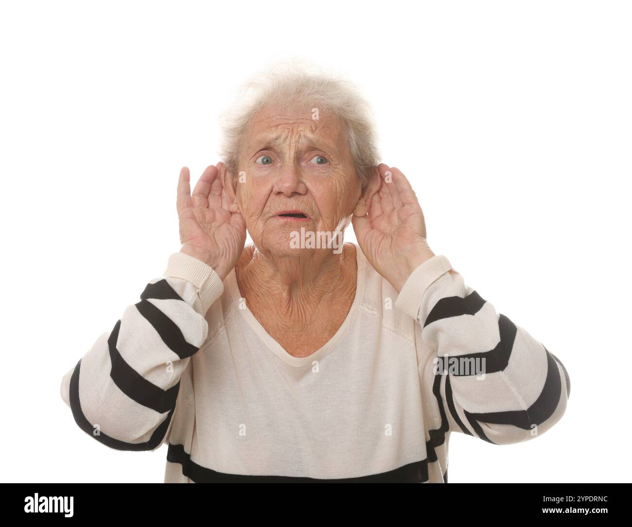 Senior woman showing hand to ear gesture on white background Stock ...