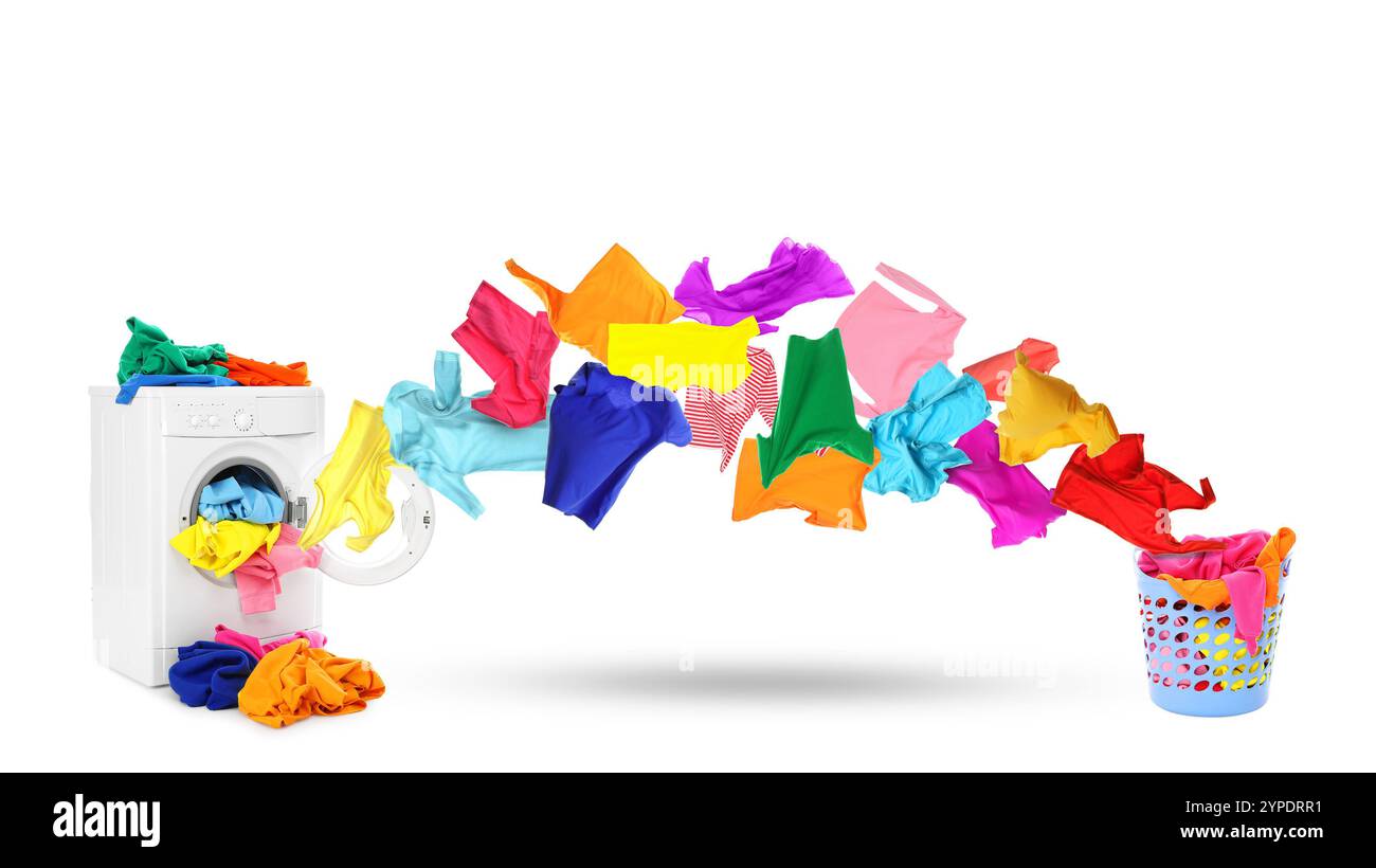 Clean colorful clothes flying out of washing machine into laundry ...