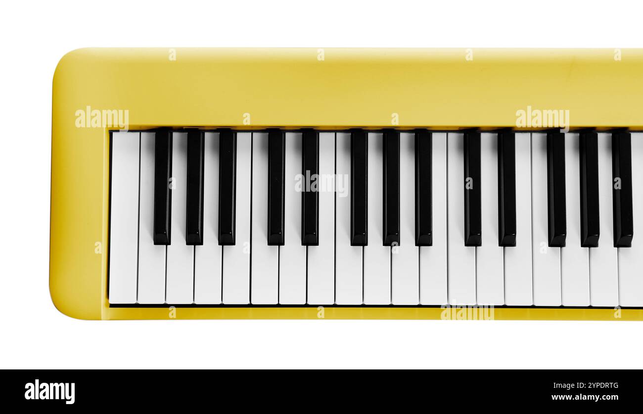Yellow synthesizer isolated on white, top view. Electronic musical ...