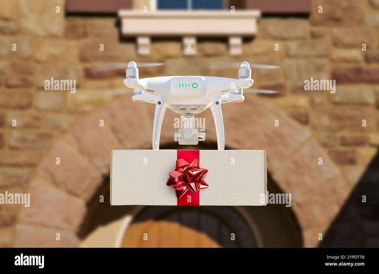 Unmanned UAV Quadcopter Drone Delivering Box With Red Bow and Ribbon To ...