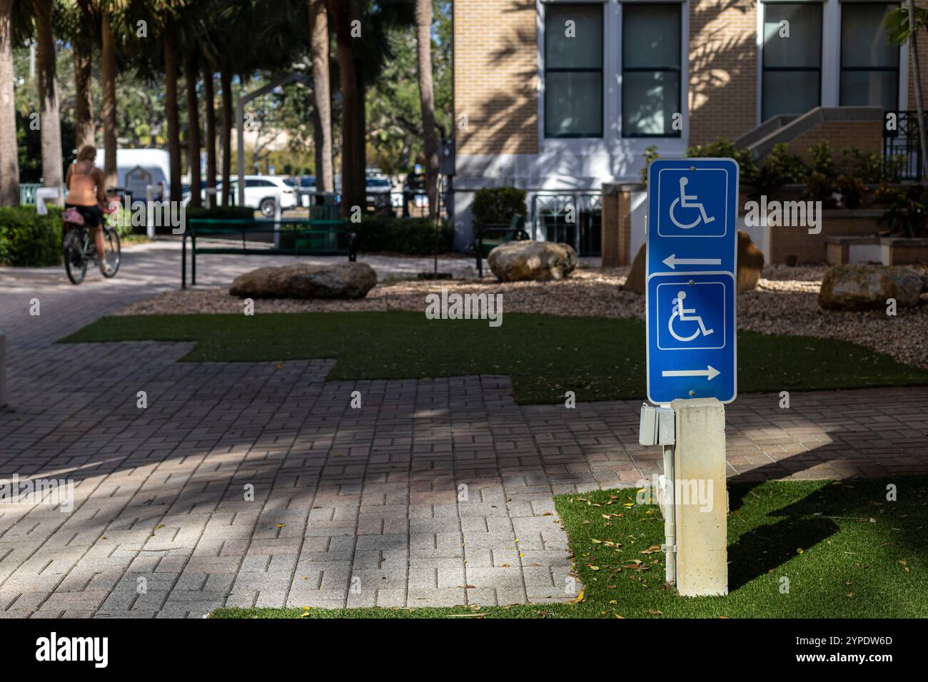 Sign on the street indicating the access route for disabled people ...