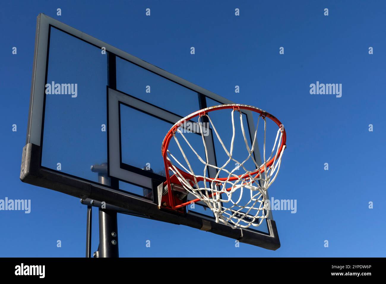 View of a transparent basketball hoop on the street Stock Photo - Alamy