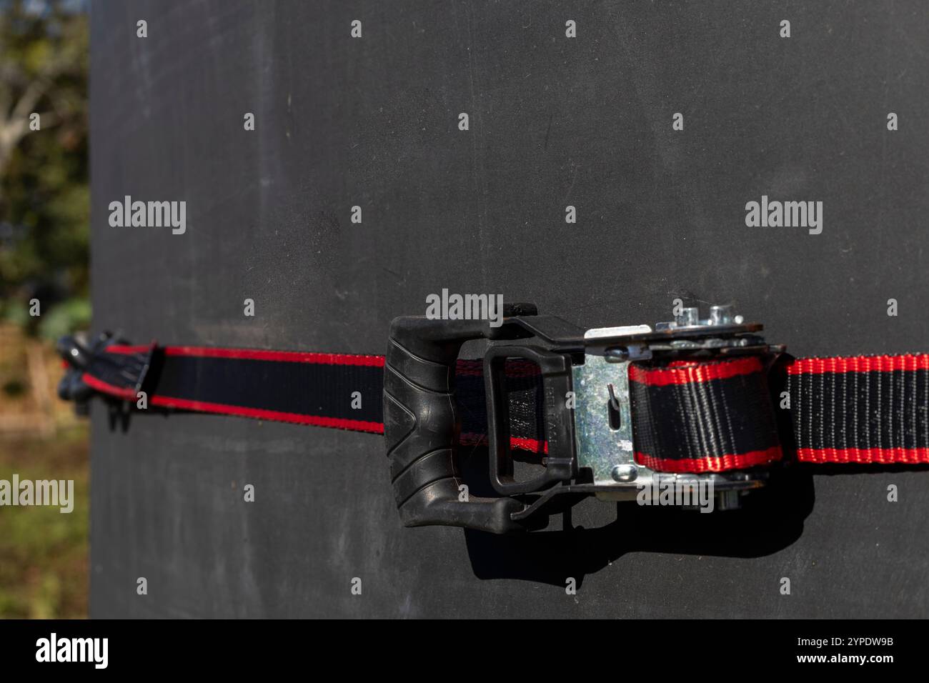 Nylon trailer strap or sling with metal bridle isolated on black ...