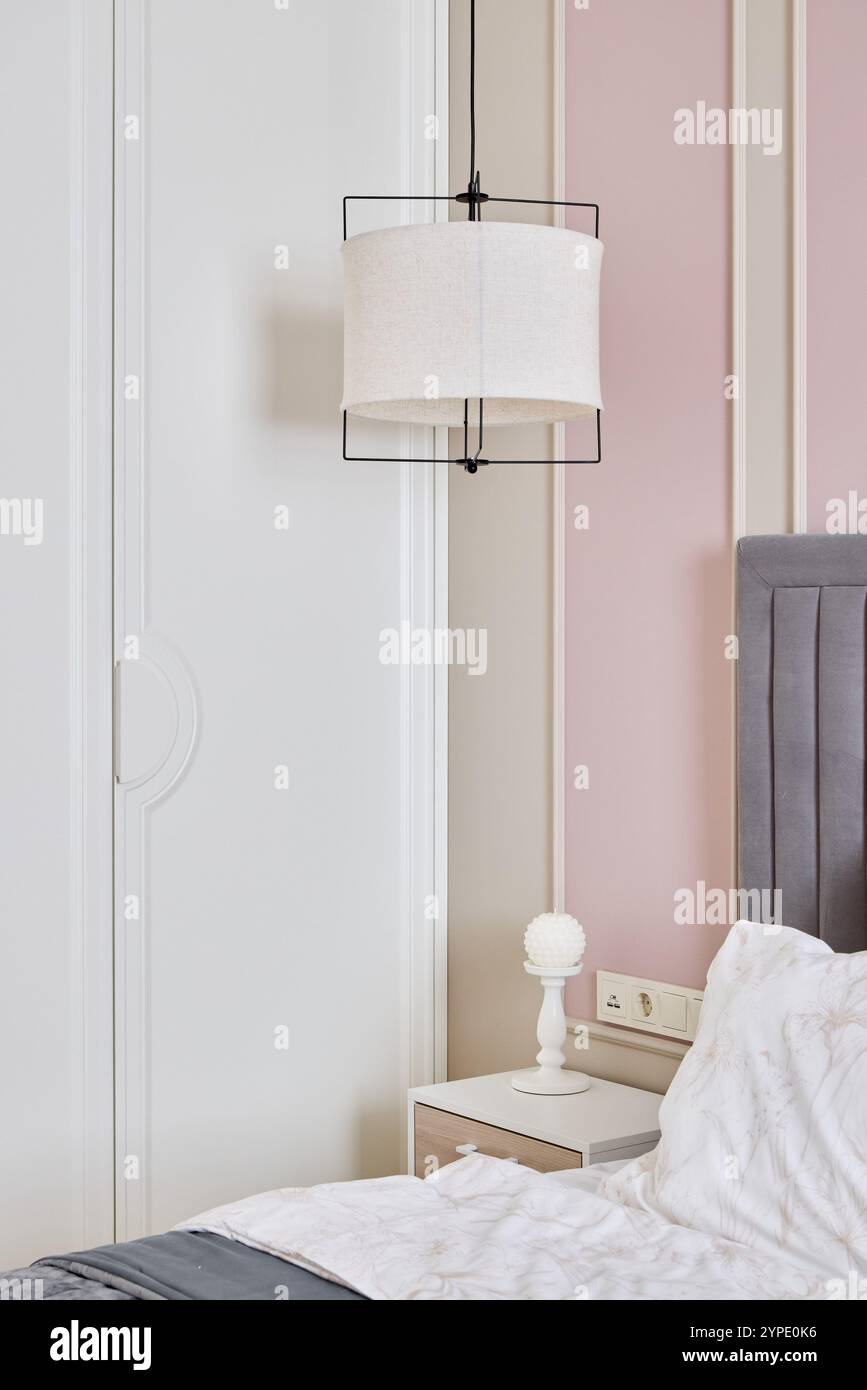 A modern bedroom designed with elegant lighting and soft, inviting ...