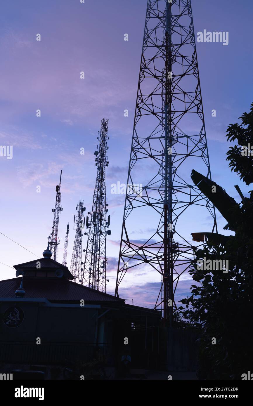 BTS tower pole or radio transmitter towering high into the sky in the morning Stock Photo - Alamy