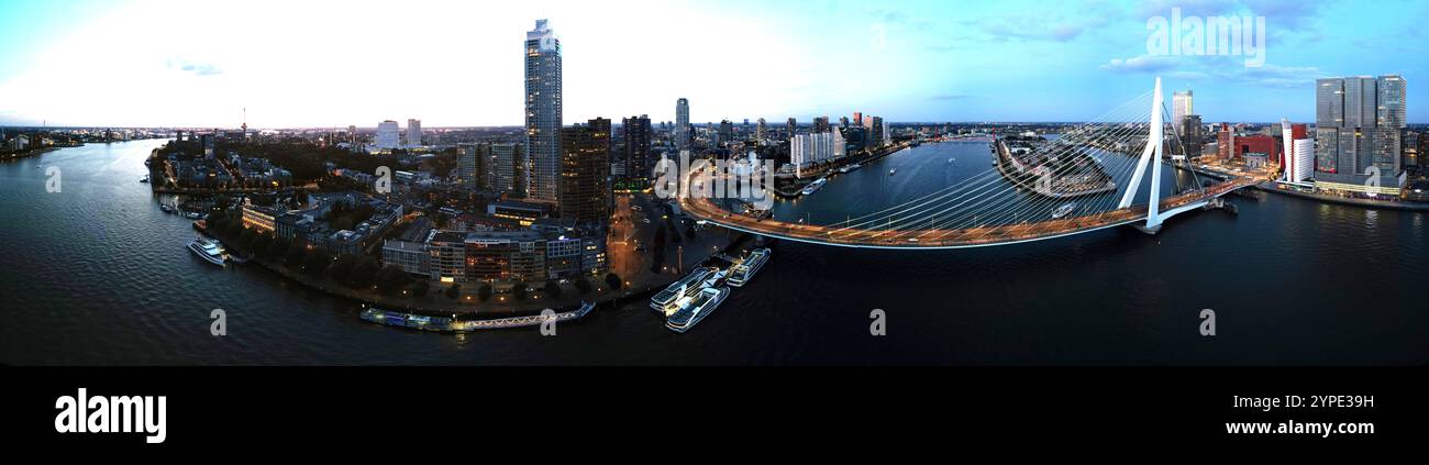 Aerial view of the city of Rotterdam and Erasmusbridge at sunset, The ...