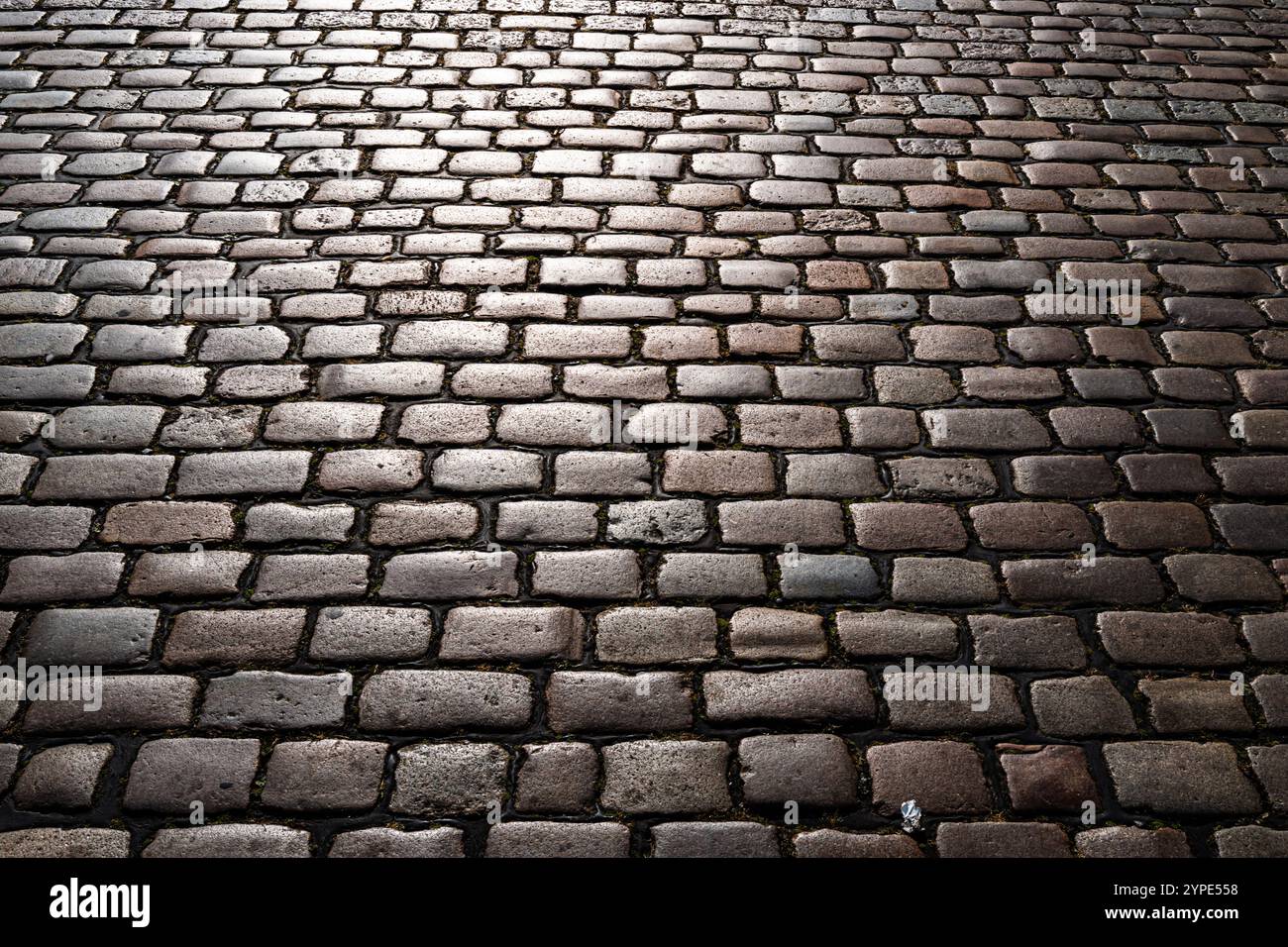 Pavement road. Background of bricks road. Stone cladding pavement ...