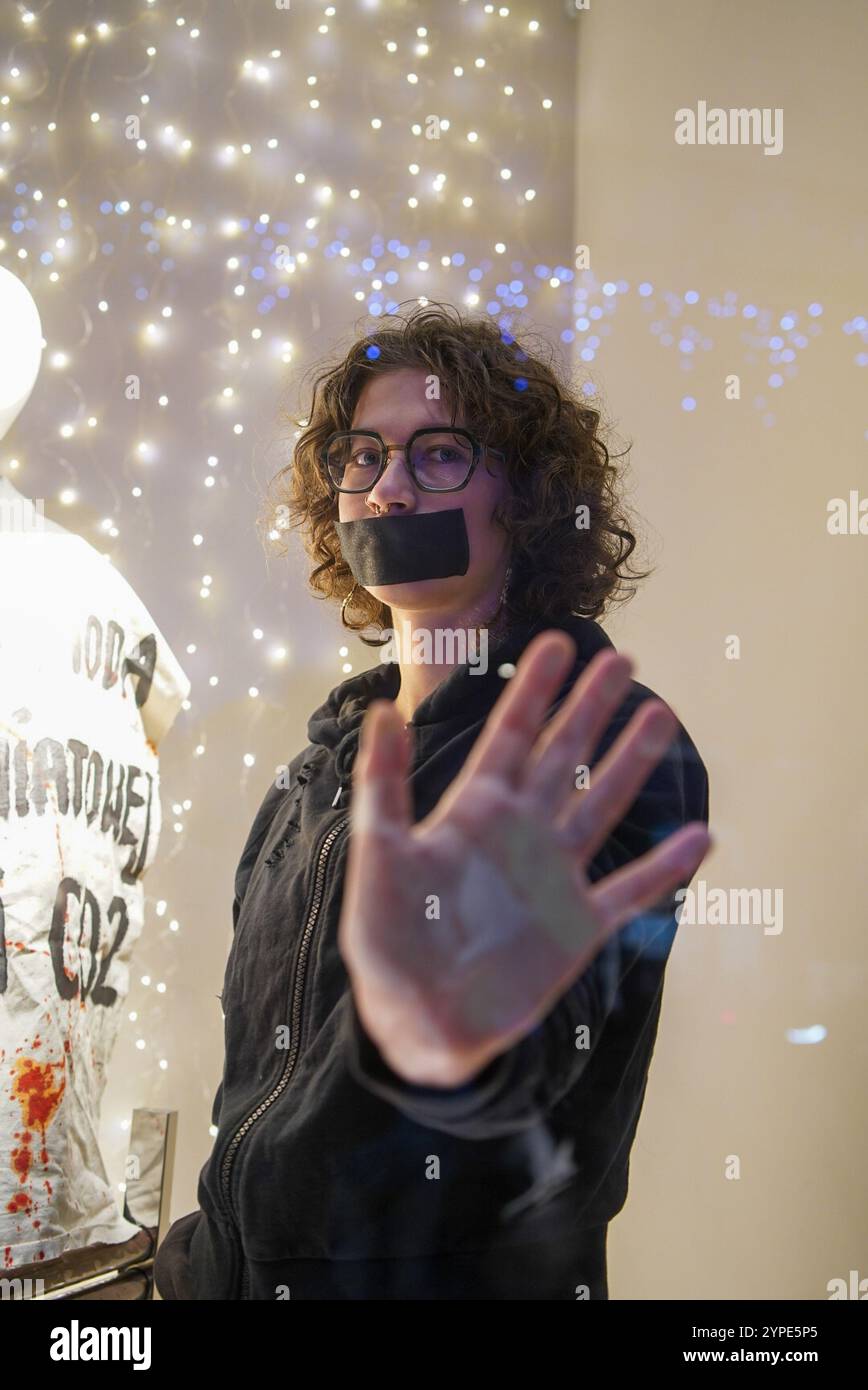 A protester's hand is seen glued to the window during a demonstration ...