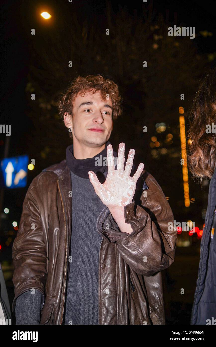 A protester shows off his hand with traces of glue on it during the ...