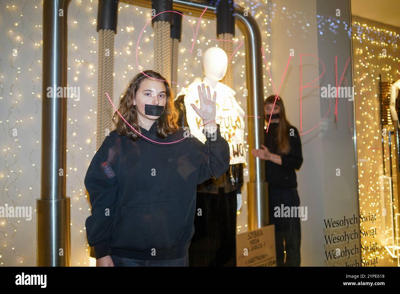 A protester's hand is seen glued to the window during a demonstration ...
