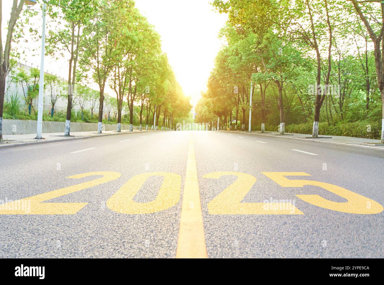 The straight highway surface is marked with 2025 Stock Photo - Alamy