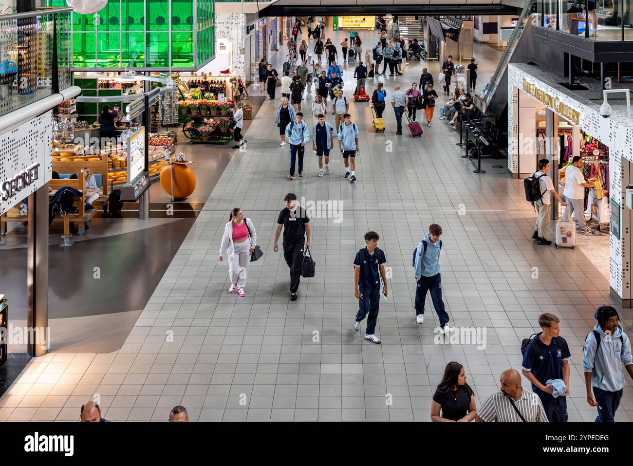 Passengers in terminal building at Schipol International Airport ...