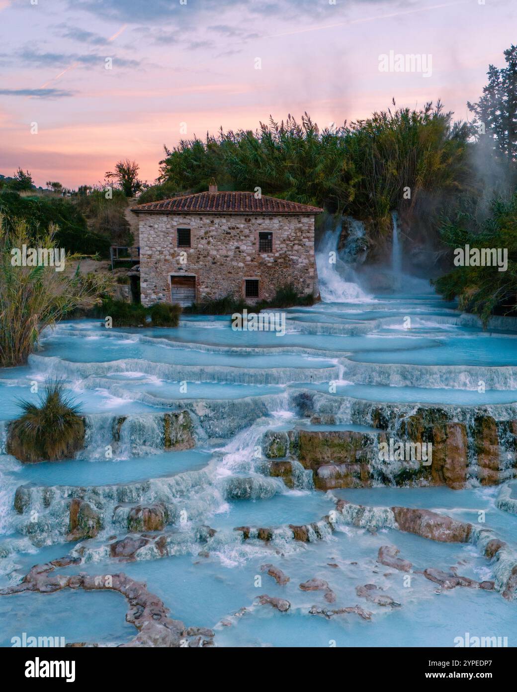 Saturnia thermal baths in Tuscany at sunrise casting a magical glow ...