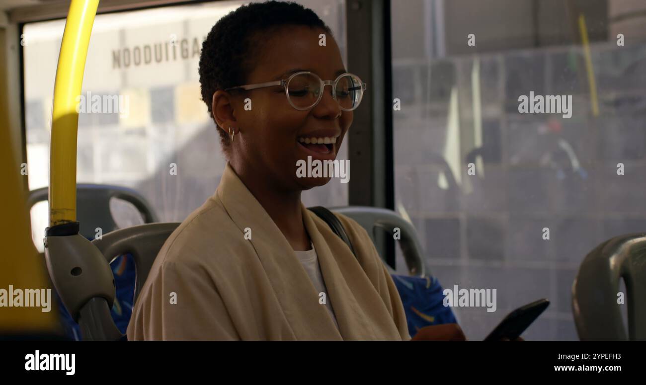 Female commuter using mobile phone hi-res stock photography and images - Alamy