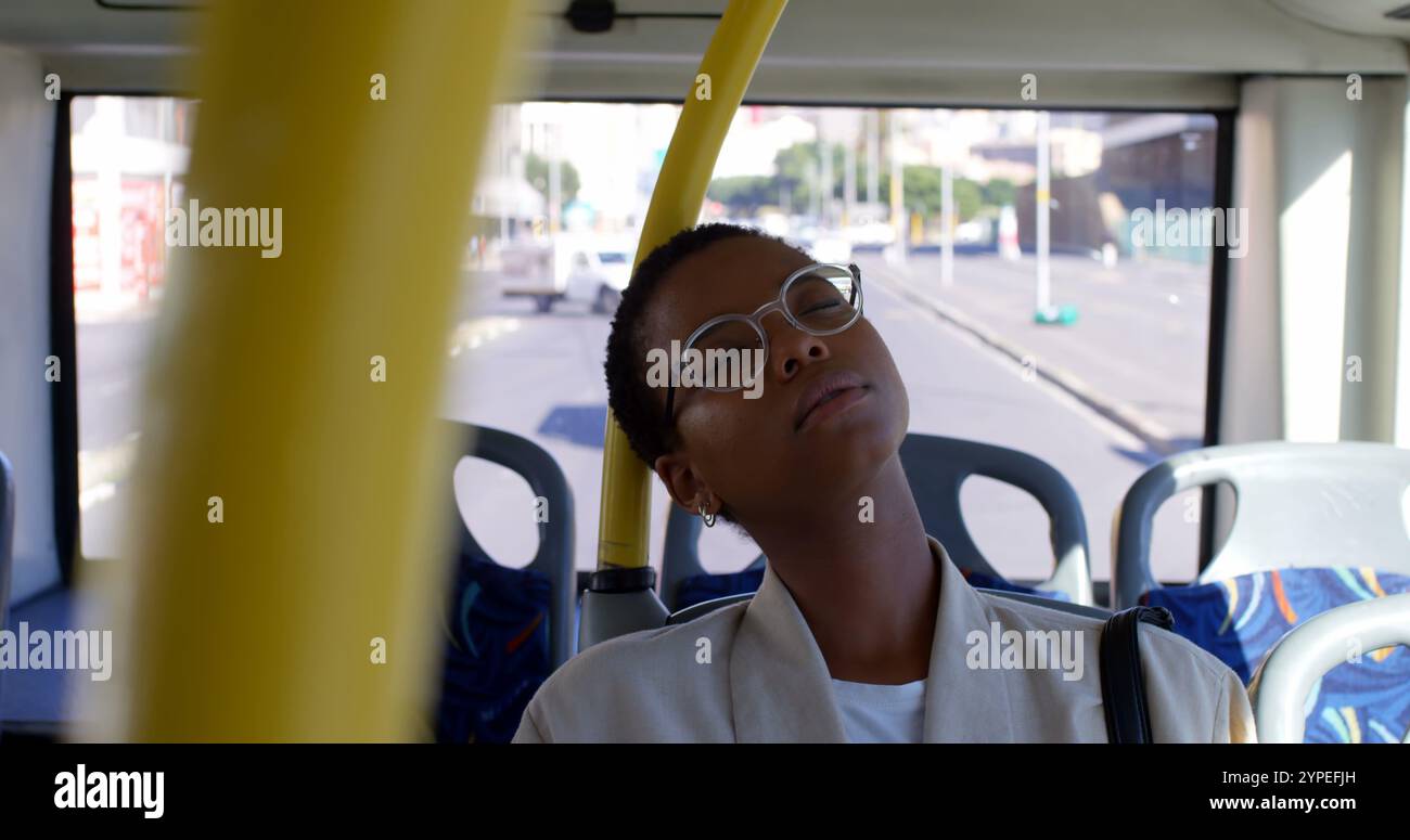 Young female commuter sleeping while travelling in bus 4k Stock Photo ...