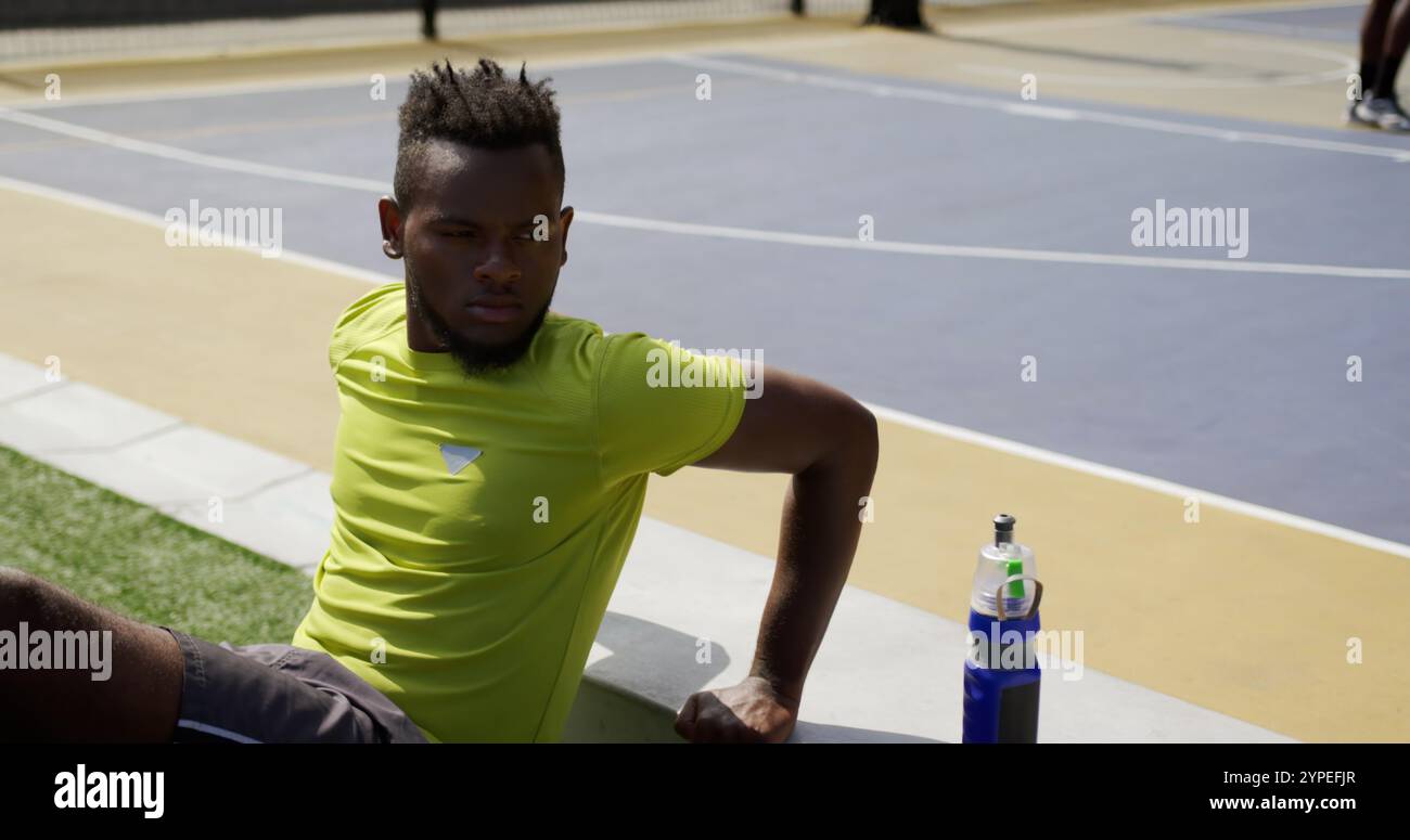Front view of African american basketball player exercising in ...