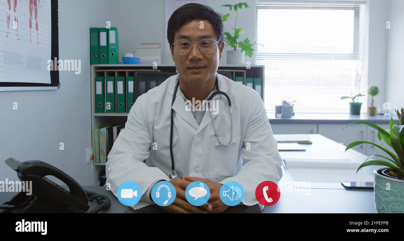 Asian male healthcare worker wearing a lab coat, having a image meeting ...