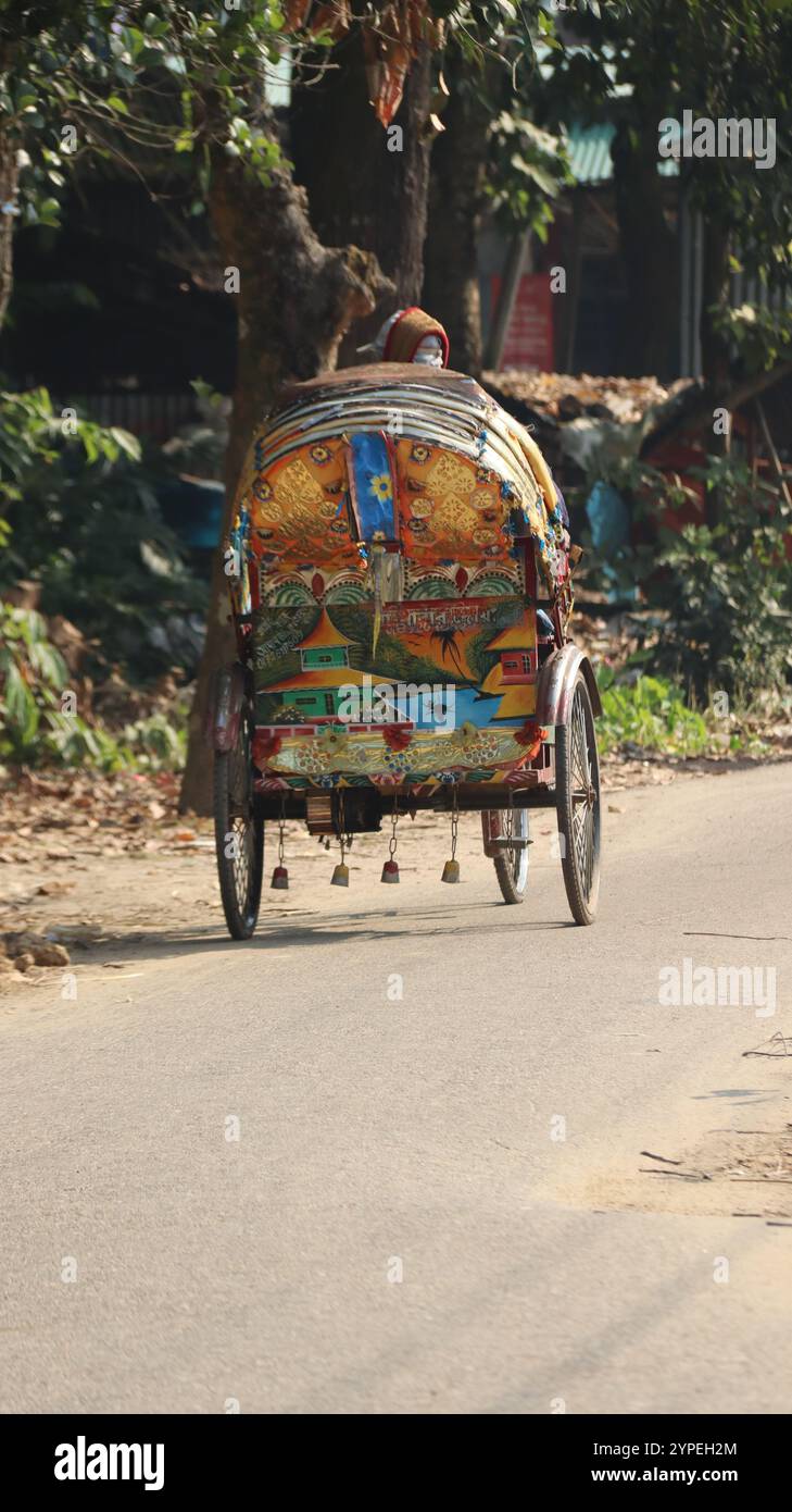 Colorful Traditional Rickshaw on a Serene Tree-Lined Pathway Stock ...