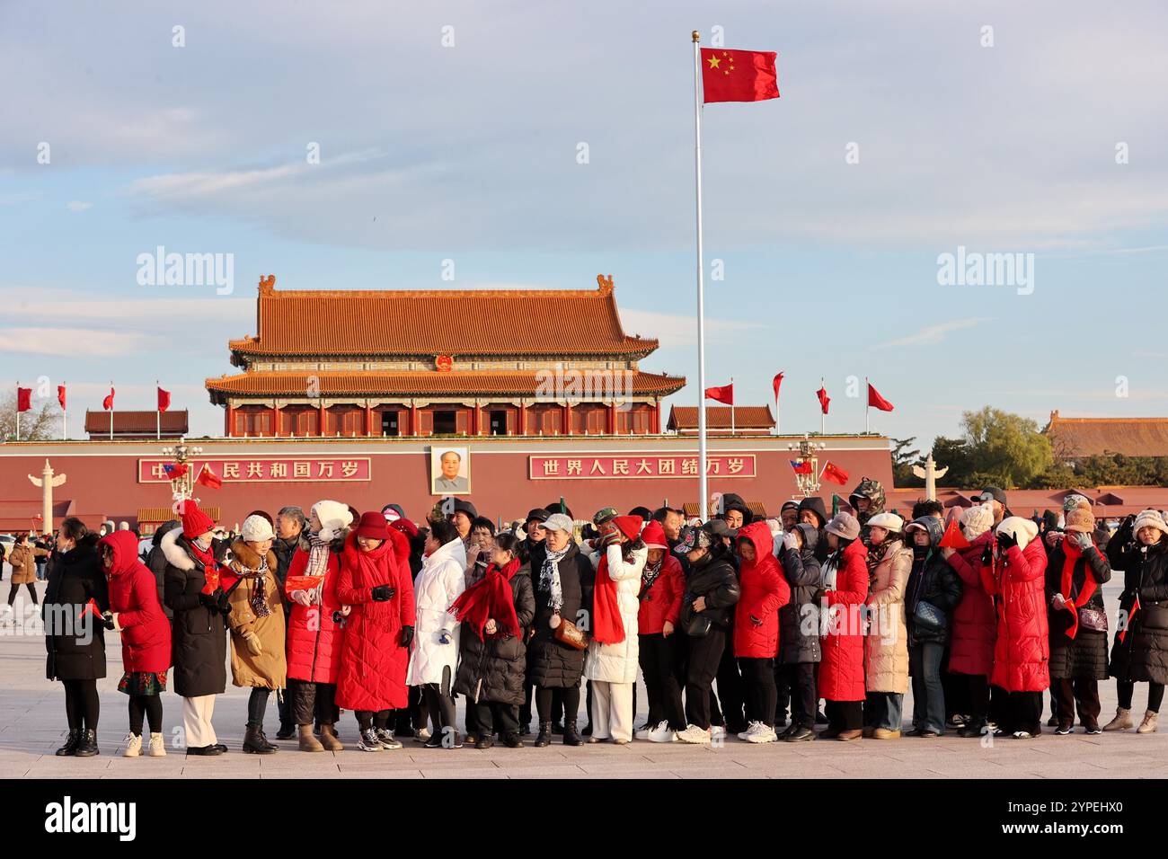 Tourists wear thick clothes to visit the Tiananmen Square in Beijing ...