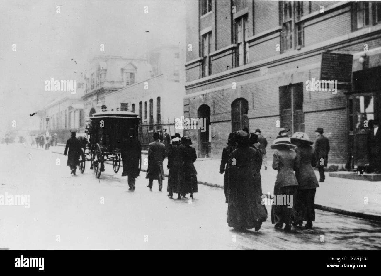 Mourners for Triangle fire victims follow a horse-drawn hearse. The ...