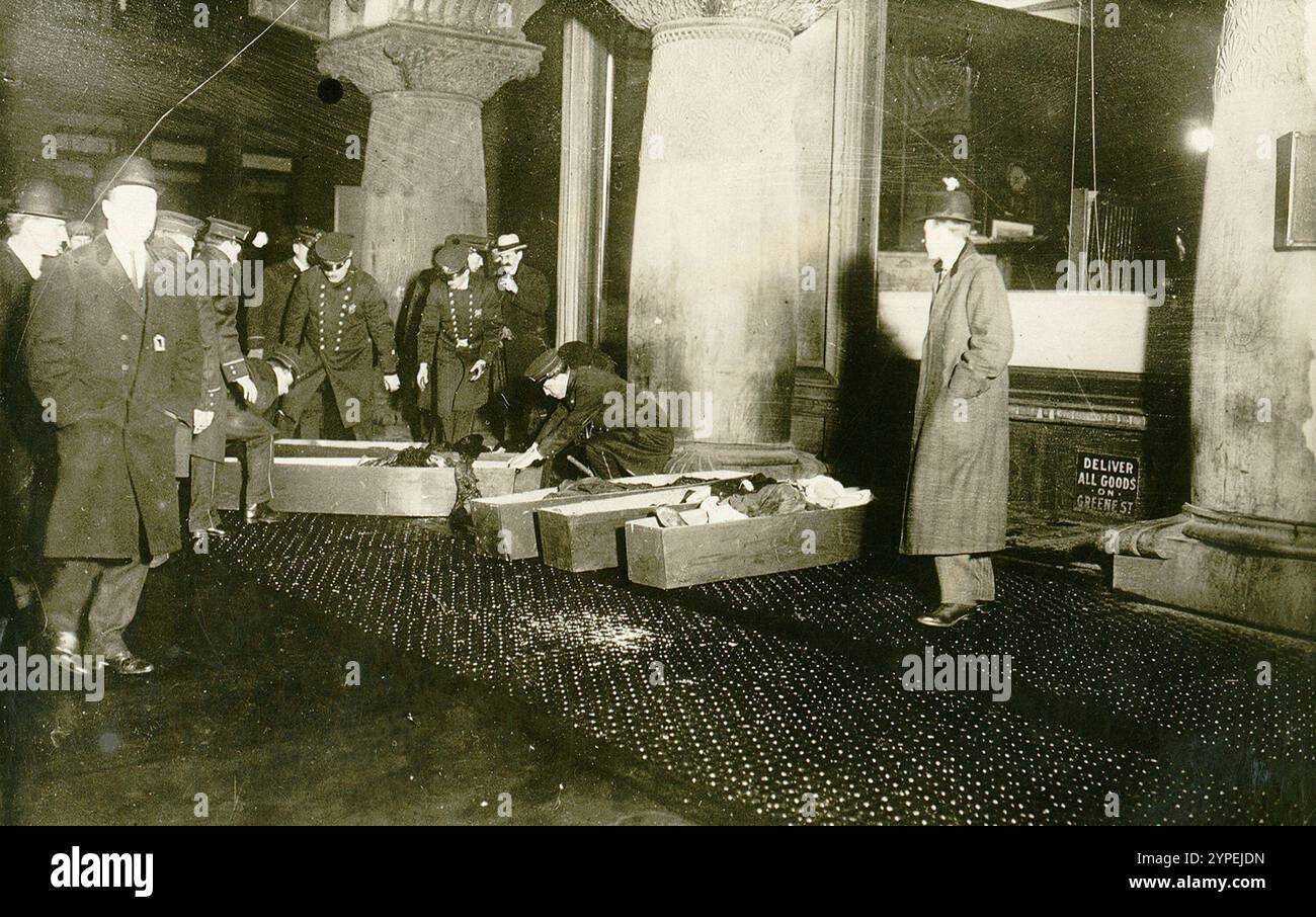Bodies of victims of the Triangle Shirtwaist Fire being placed in ...