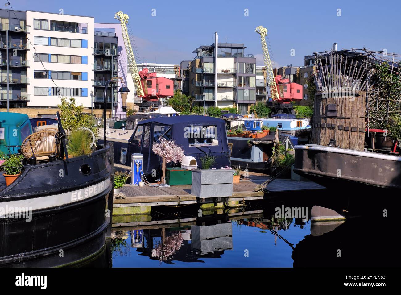 Colourful boats with mirror reflections in Poplar Dock Marina at Isle ...