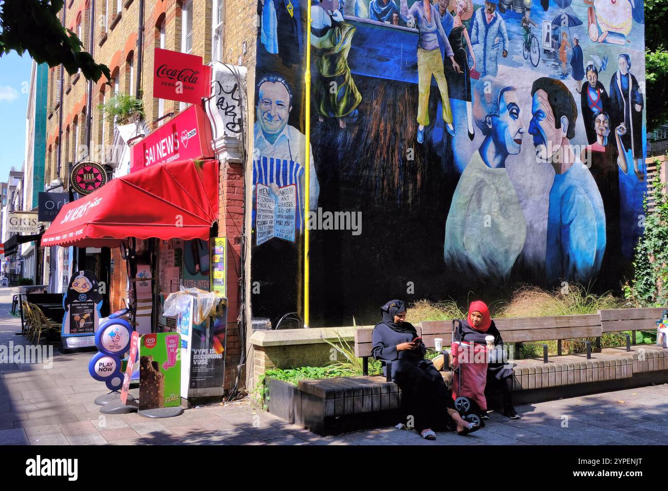 Fitzrovia Mural street art in Whitfield Gardens, shops and people in ...