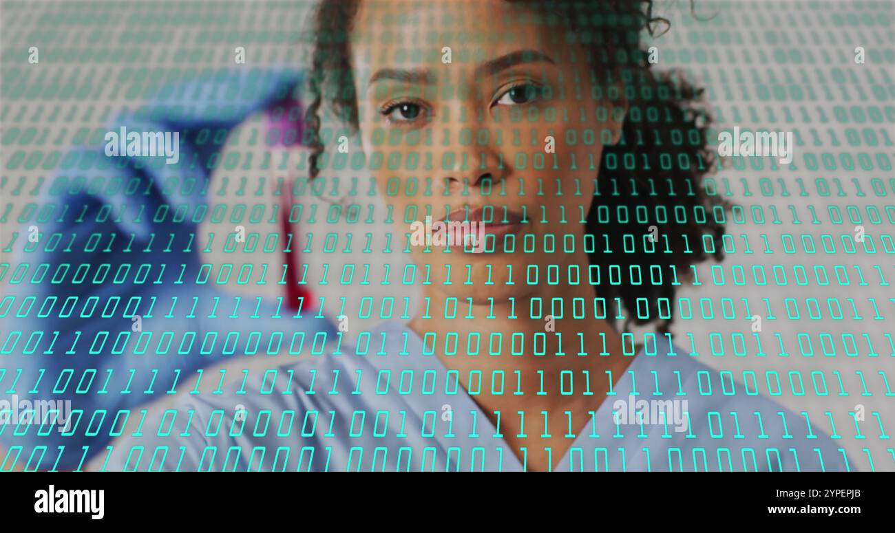 Scientist holding test tube with binary coding over laboratory image ...