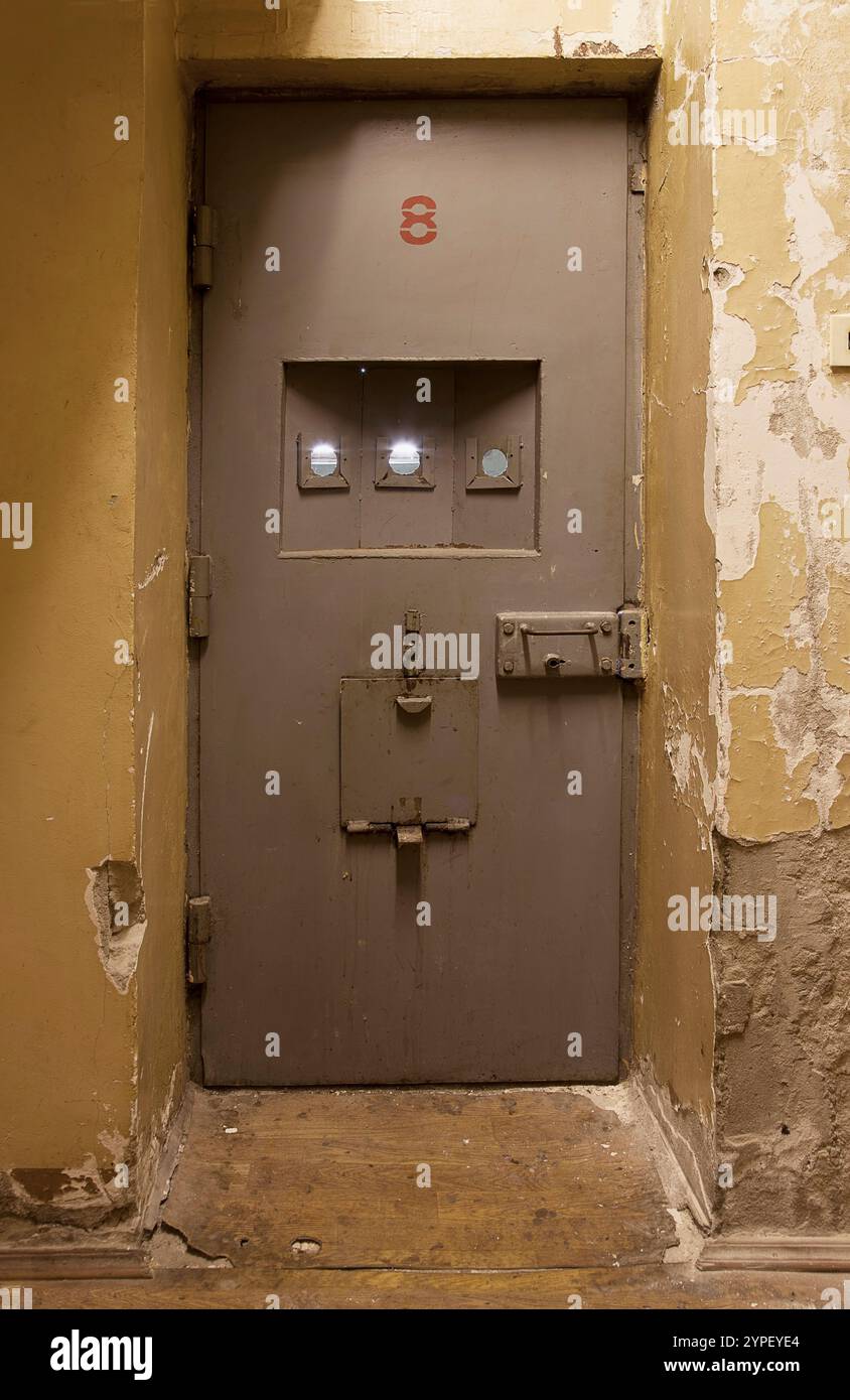Light coming in through jail cell door at an abandoned prison jail ...