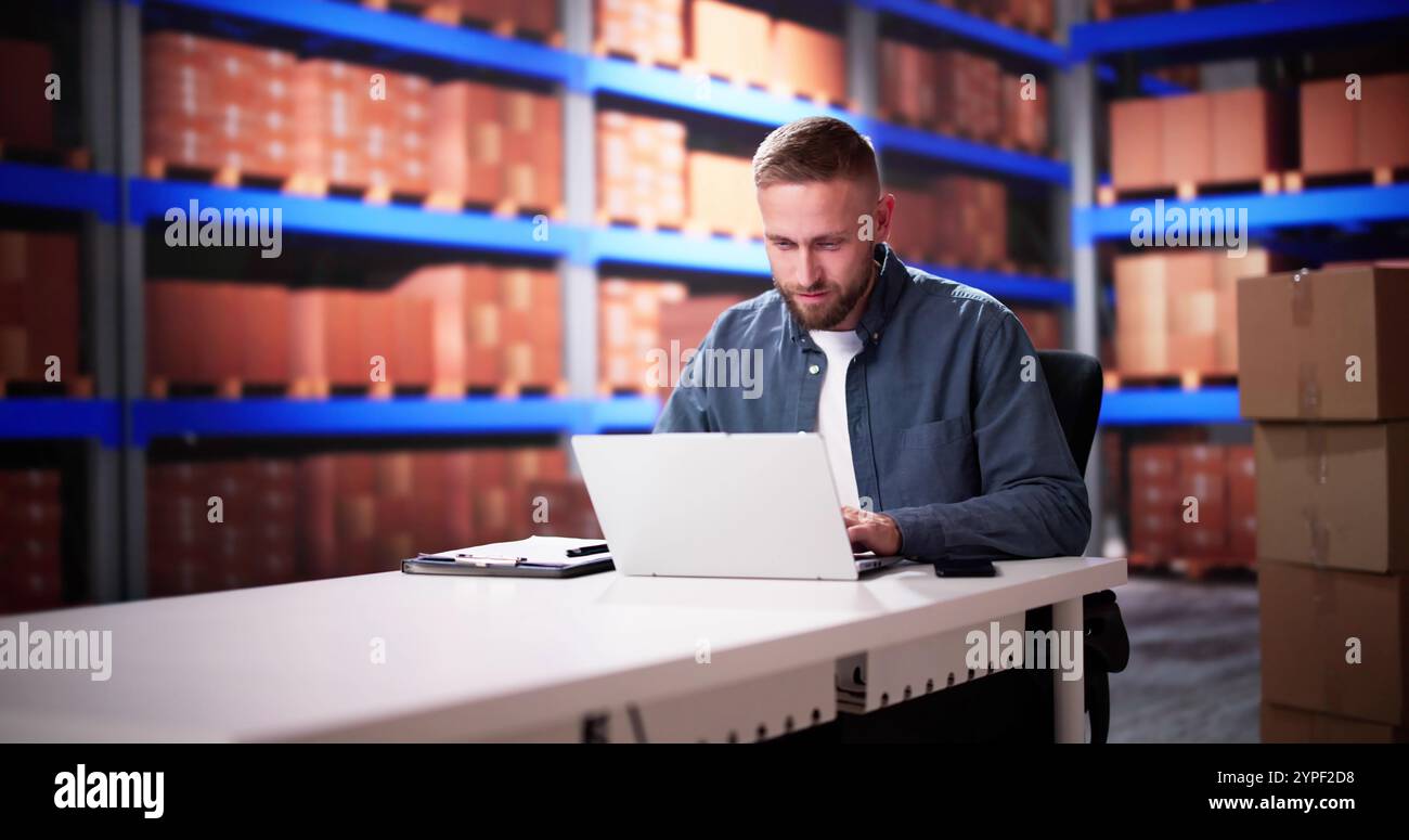 Business Man Using Laptop Computer In Warehouse For Inventory ...