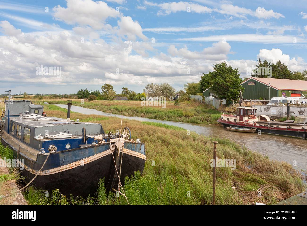 Old barges moored on the River Crouch at the highest point of ...