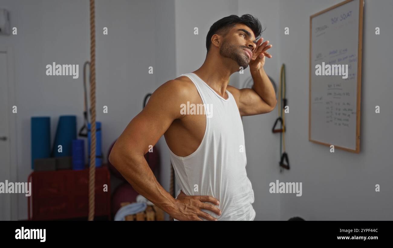 Hispanic man in white tank hi-res stock photography and images - Alamy