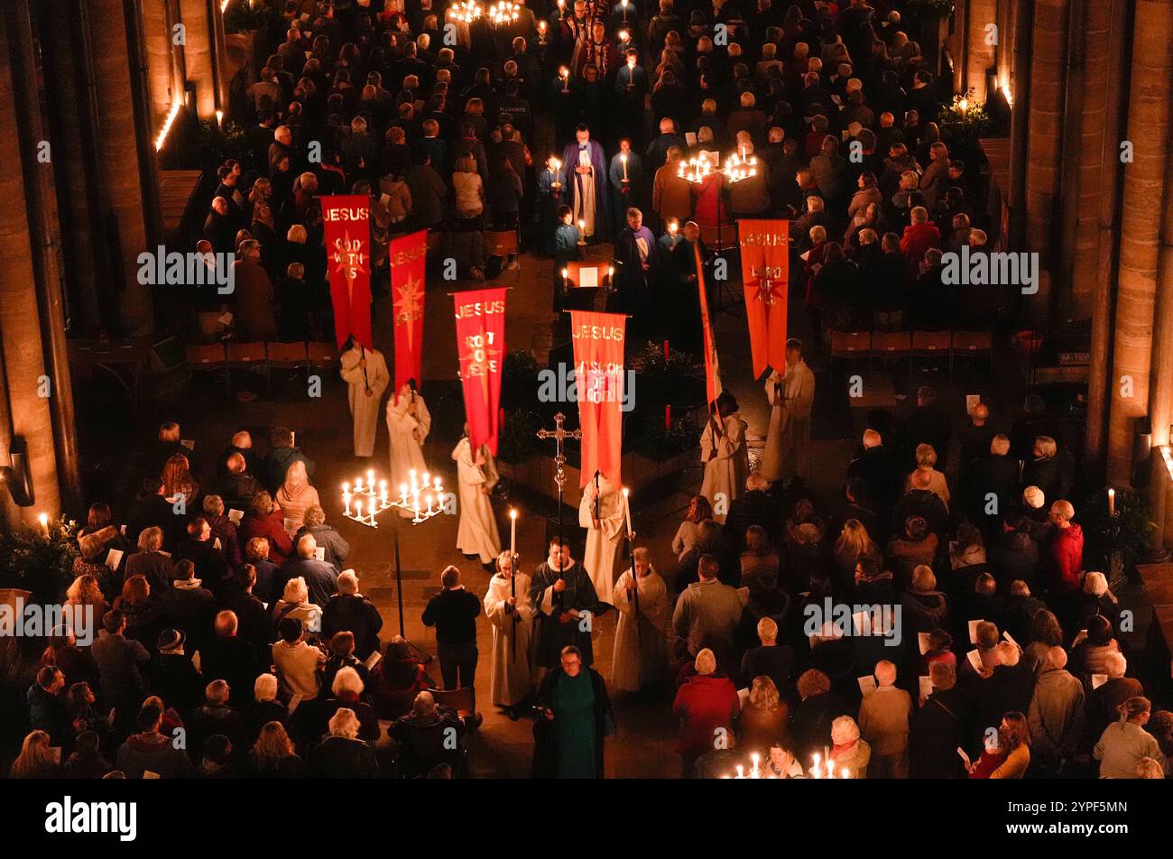 Banners are carried through the Nave during the advent procession 'From ...