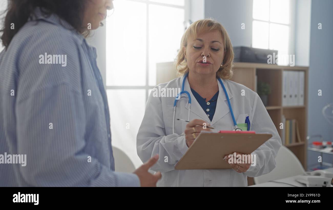 Female doctor taking interview hi-res stock photography and images - Alamy