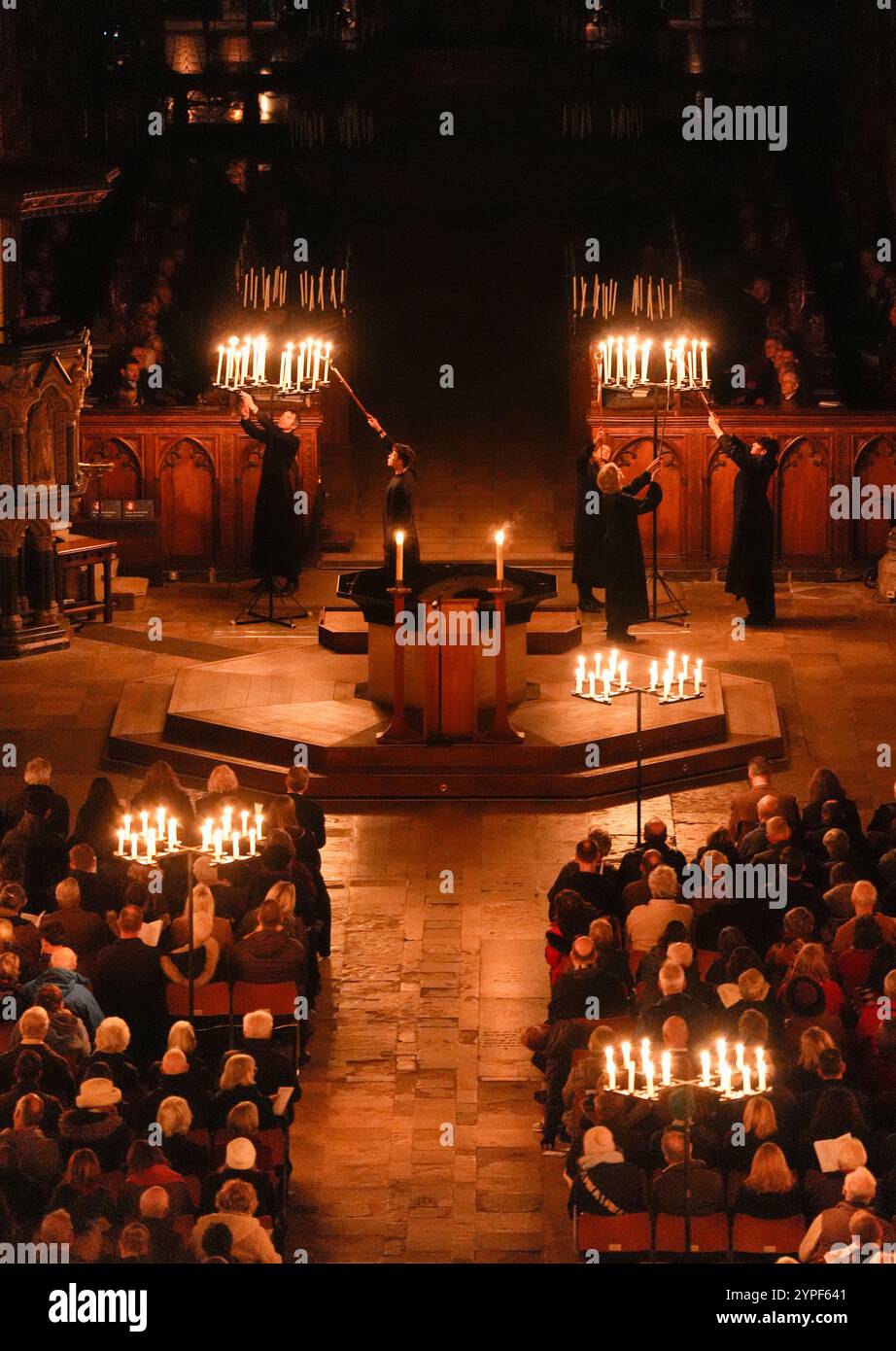 Candles are lit during the advent procession 'From Darkness to Light ...