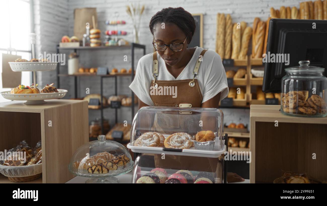 Woman looking pastries bread cakes hi-res stock photography and images ...